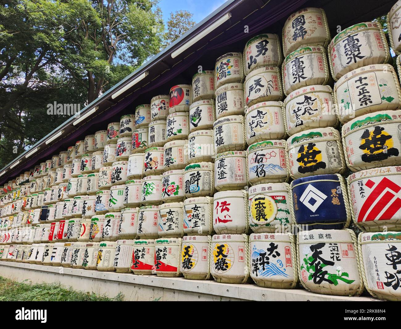 The Meiji Jingu Shrine sake barrels at the entrance of a famous ...