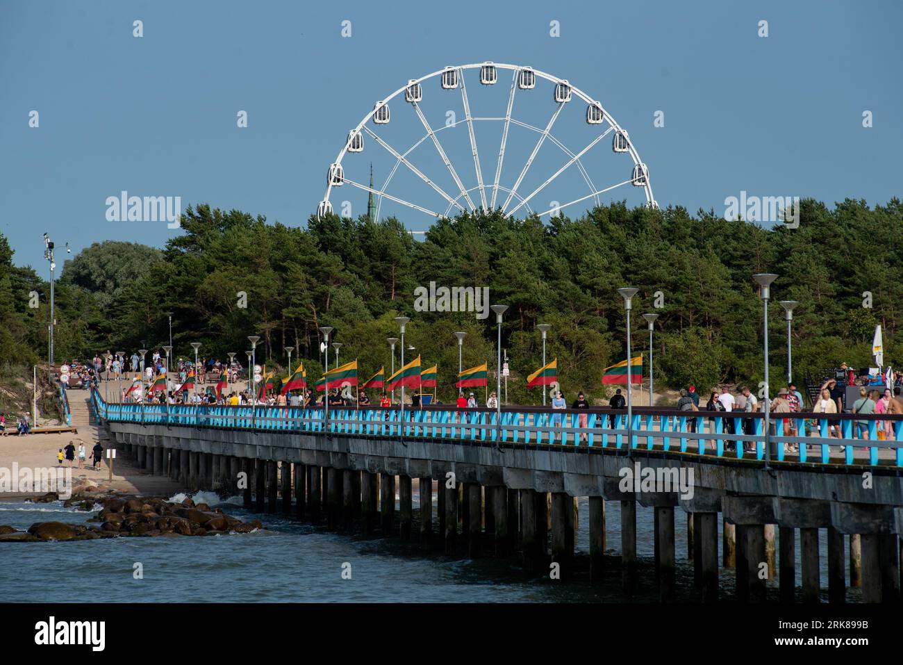 The Palanga Bridge in Lithuania is illuminated with colorful lighting ...