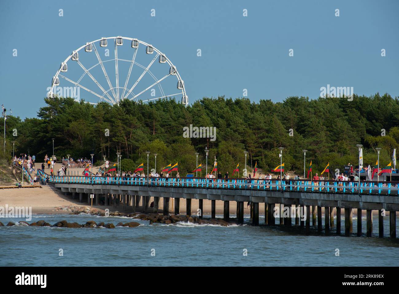 The Palanga Bridge in Lithuania is illuminated with colorful lighting ...