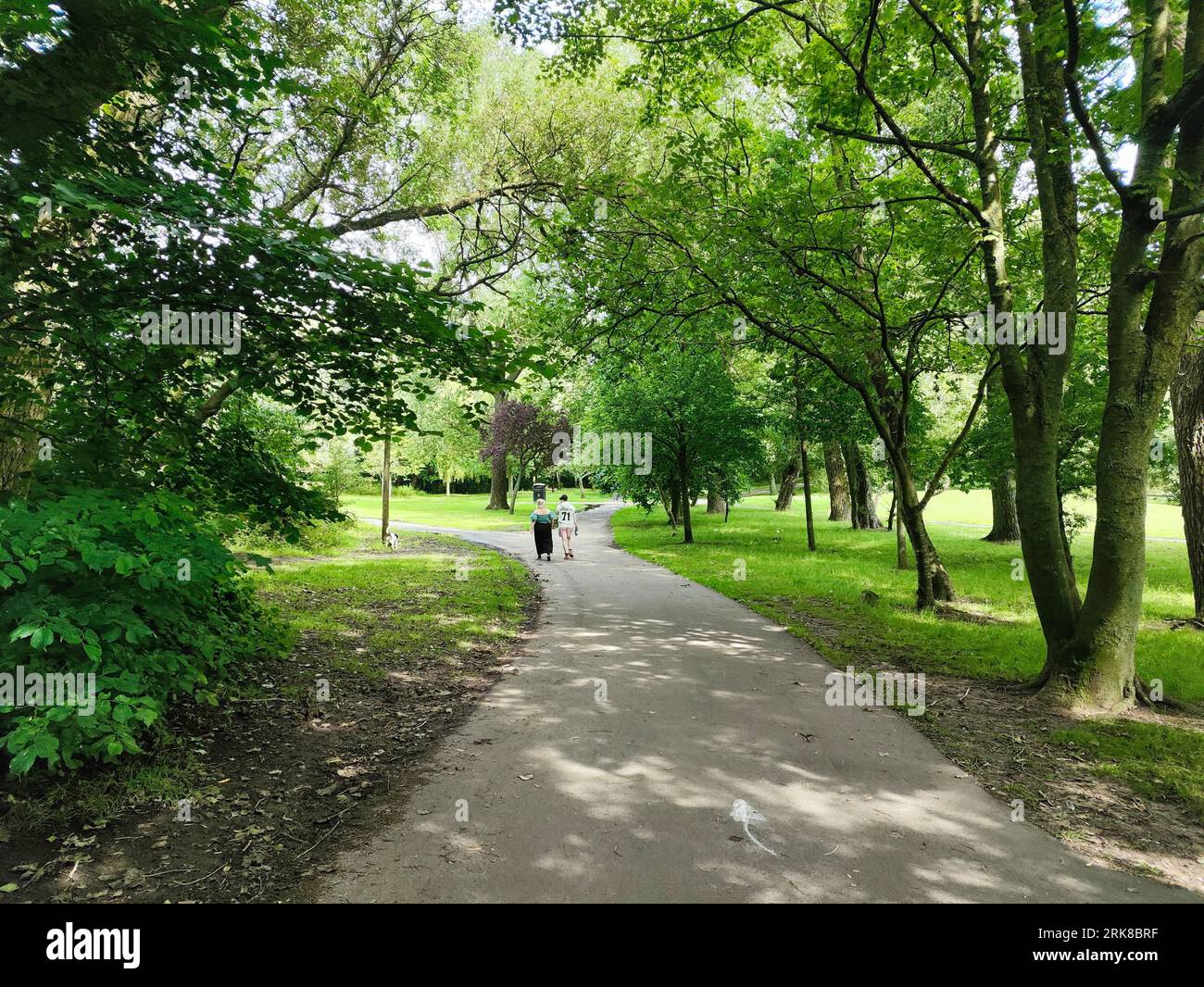 Couple stroll along pathway hi-res stock photography and images - Alamy