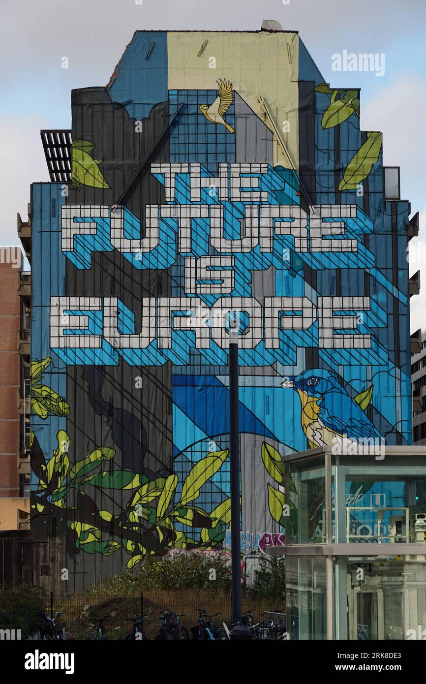 A graffiti wall depicting the word 'future' in a bright blue hue ...