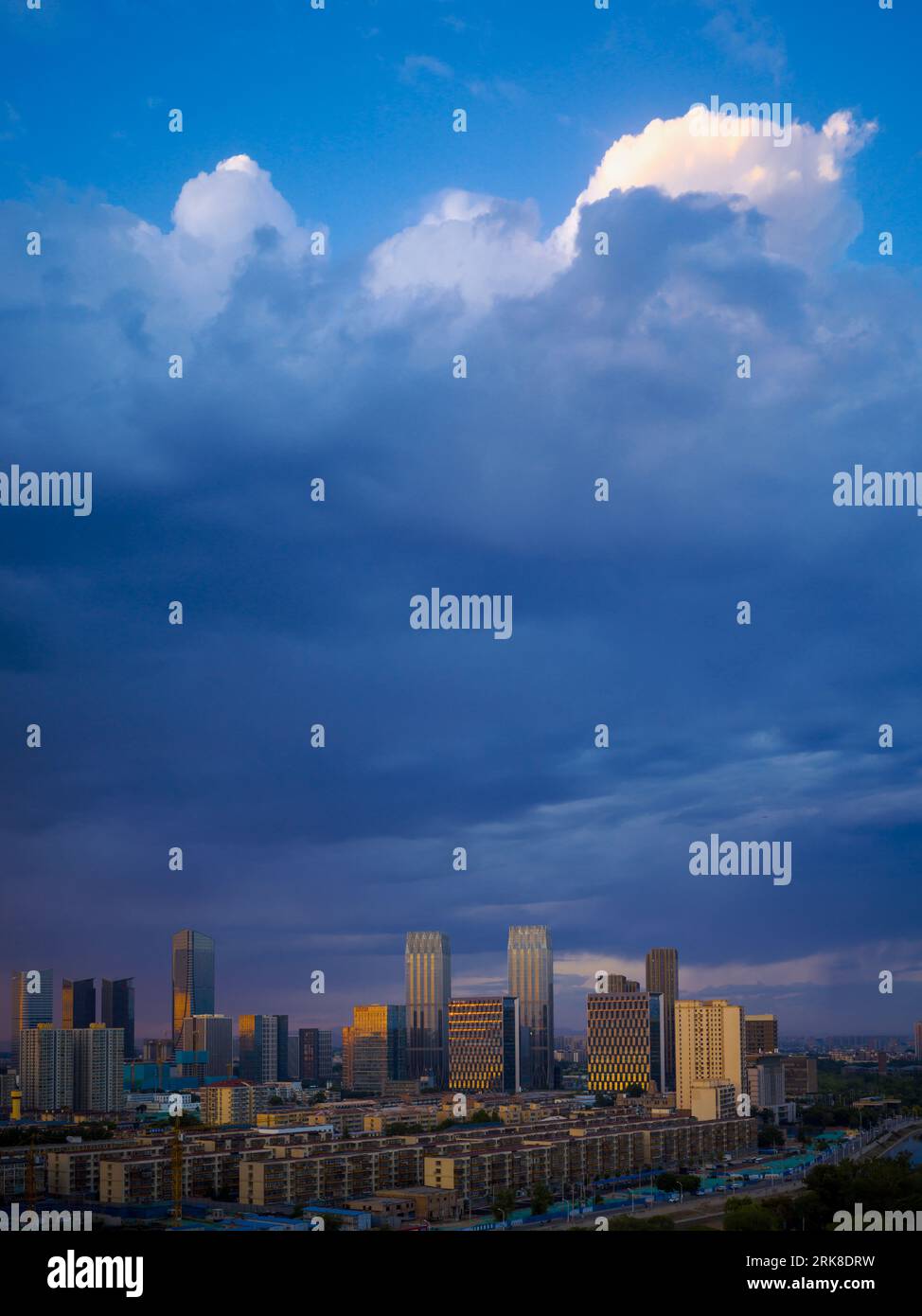 An aerial view of a modern metropolitan area featuring a skyline of ...
