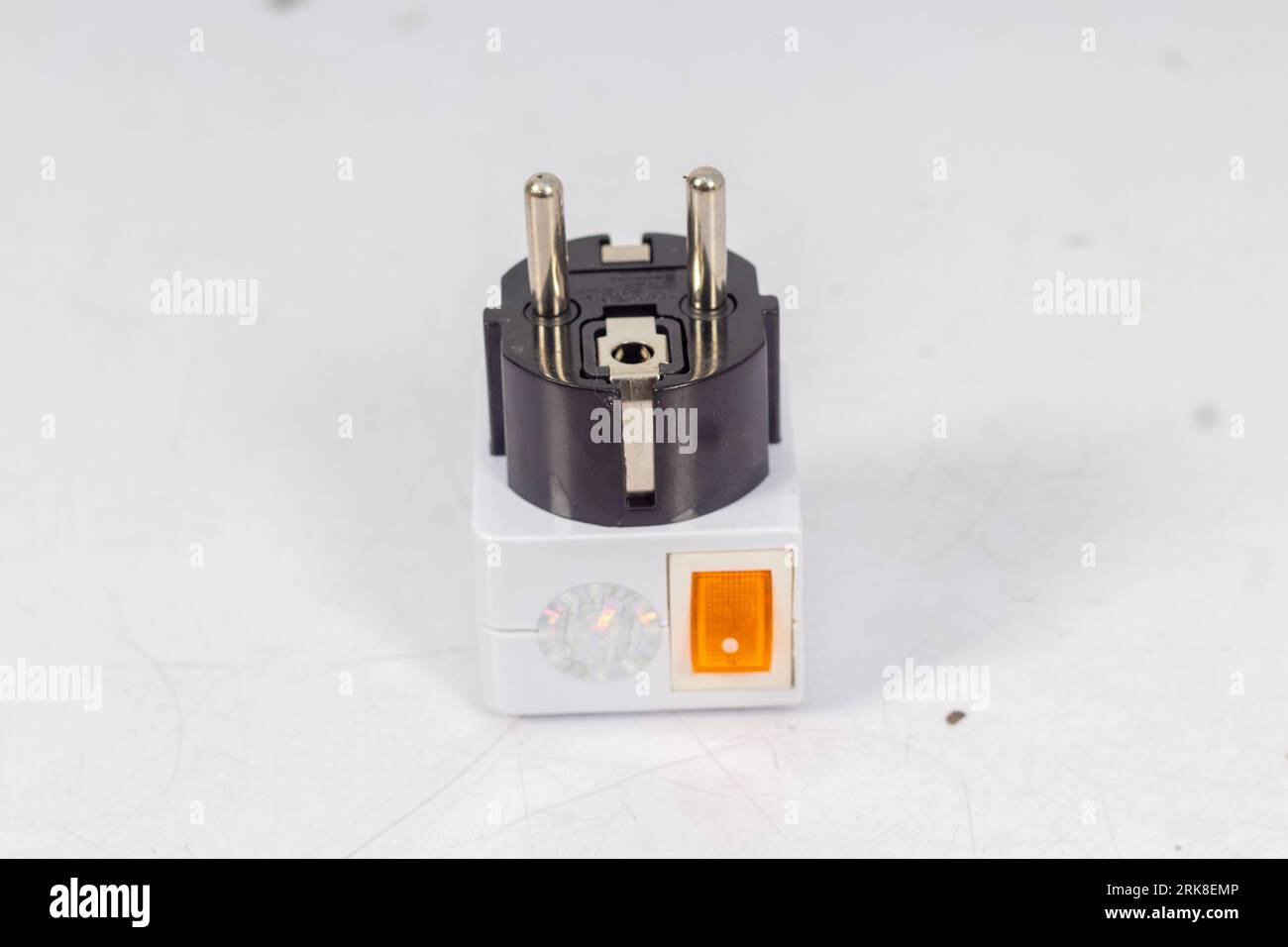 Close up of universal electric socket plug adapters, isolated on white ...