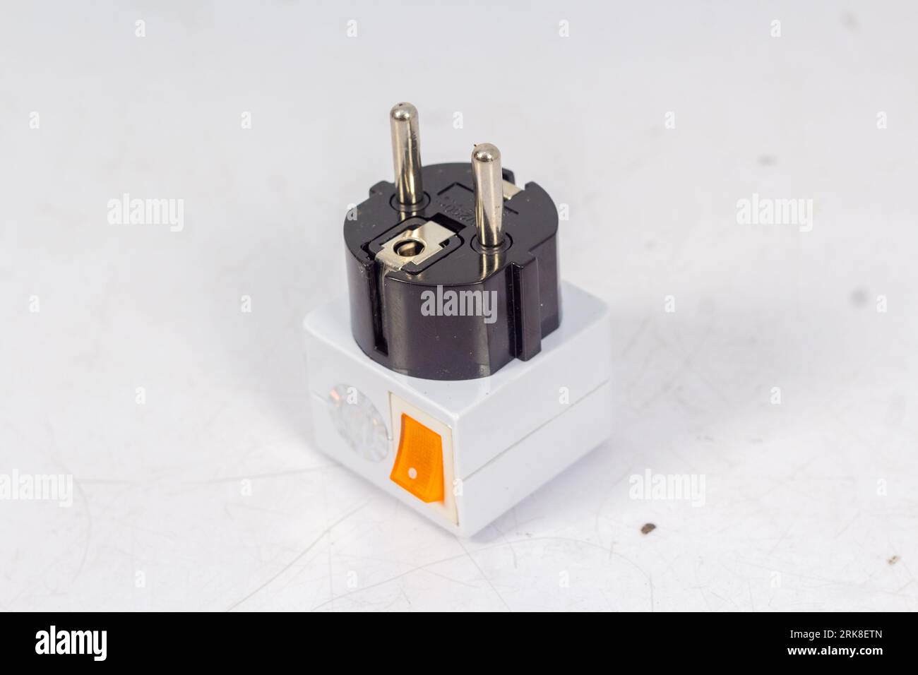 Close up of universal electric socket plug adapters, isolated on white ...