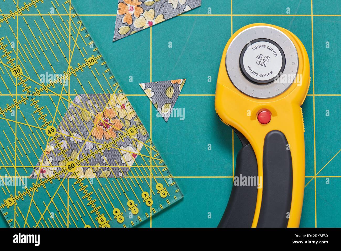 The process of cutting pieces of fabric in the shape of hexagons to ...