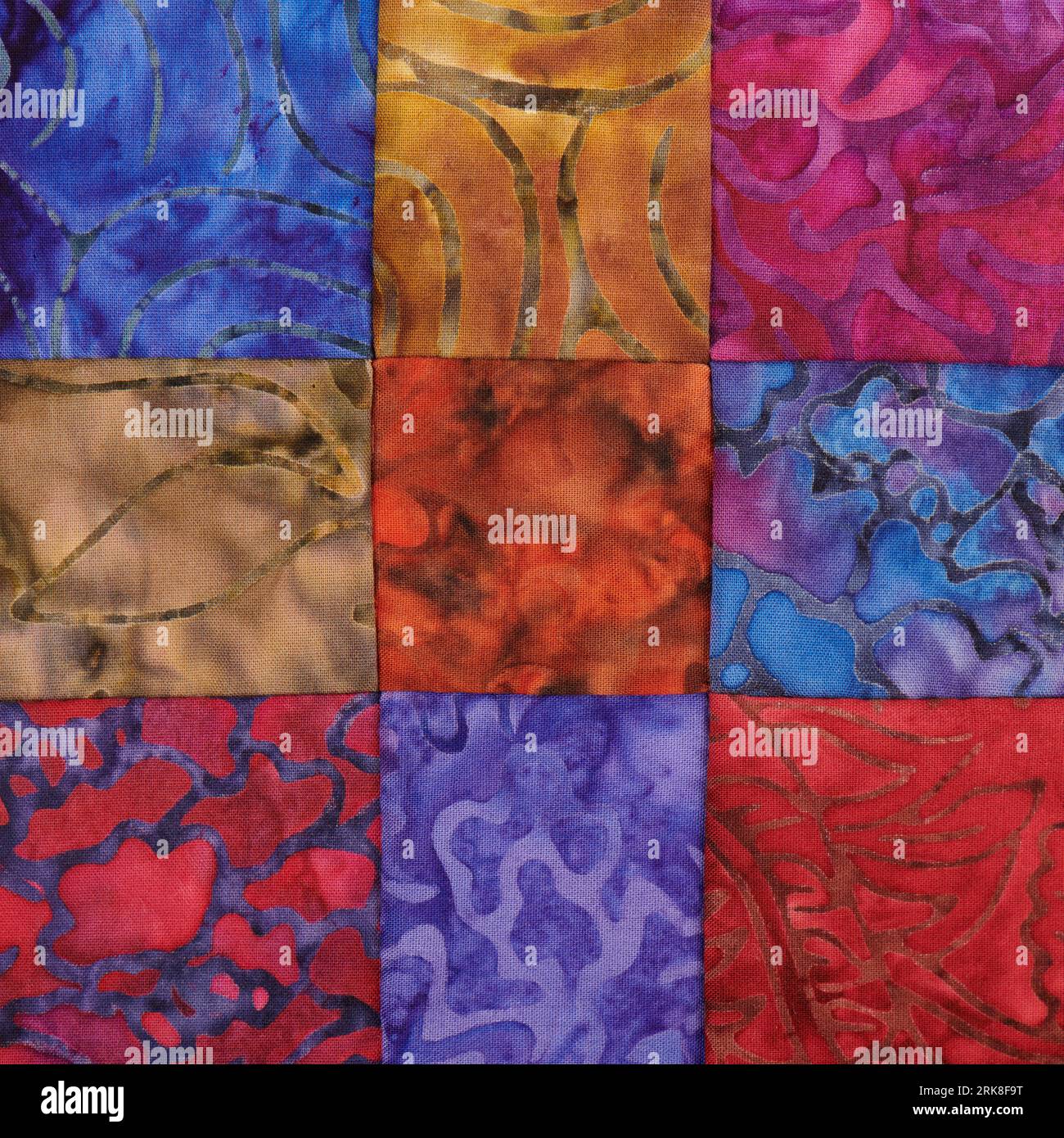 Sewn square bright pieces of batik, part of quilt, traditional ...