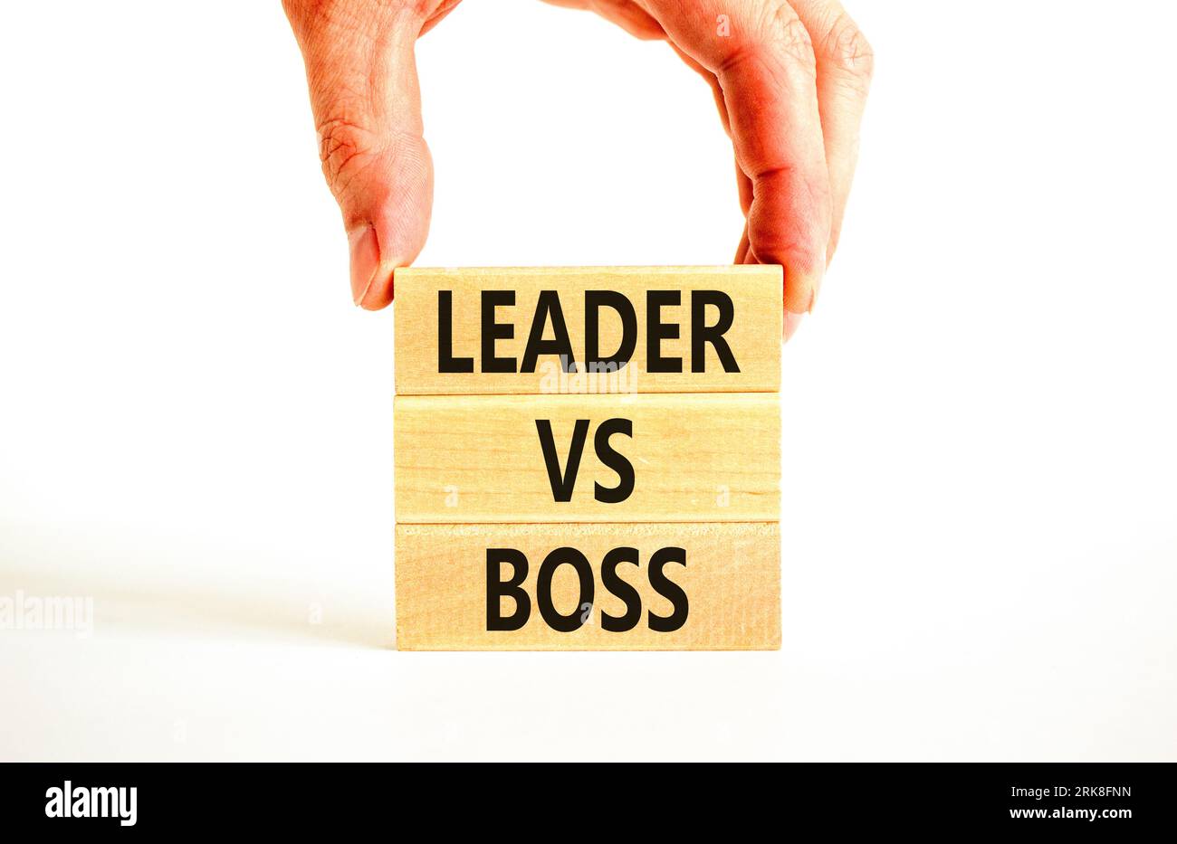 Boss vs leader symbol. Concept words Boss vs versus leader on wooden ...