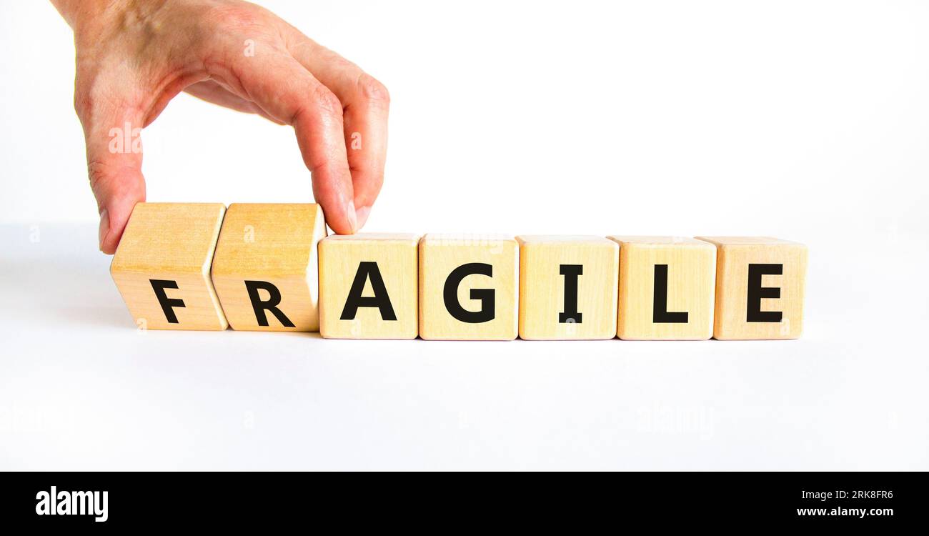 Agile or fragile symbol. Concept words Agile and Fragile on wooden ...
