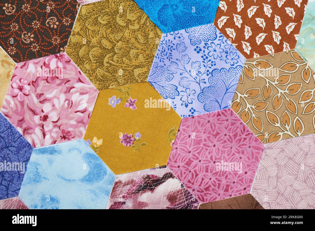Hexagon pieces of colorful fabric random ordered Stock Photo - Alamy