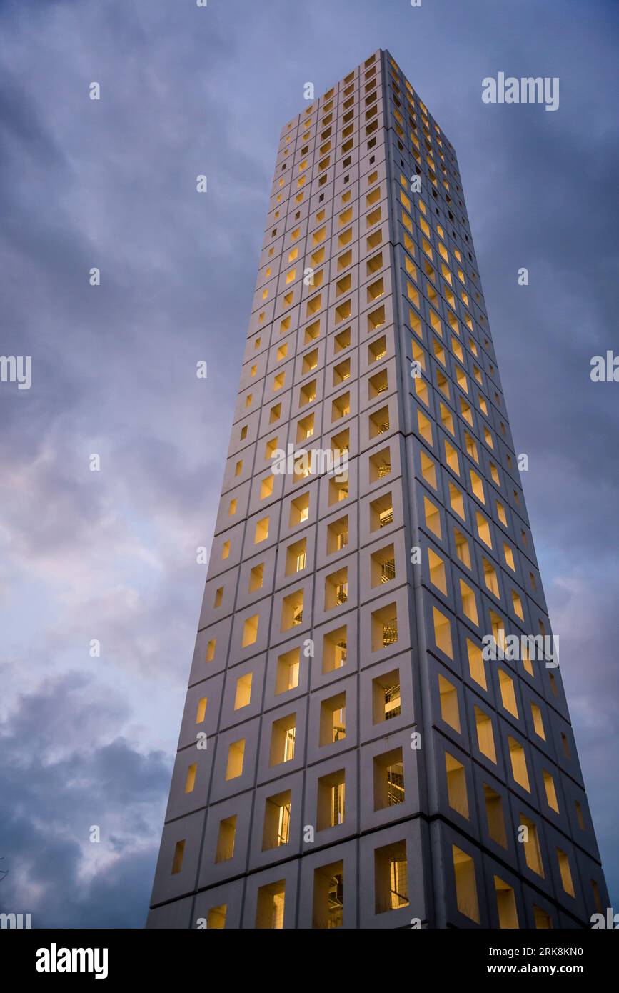 Modernist tower with illuminated windows Stock Photo - Alamy