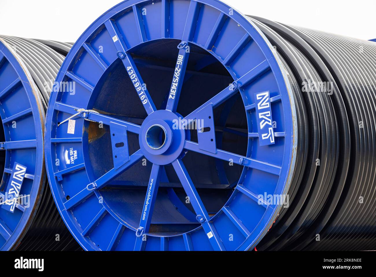 Cologne, Germany. 24th Aug, 2023. Cable drums with coiled sheathed copper cable lie on a ...