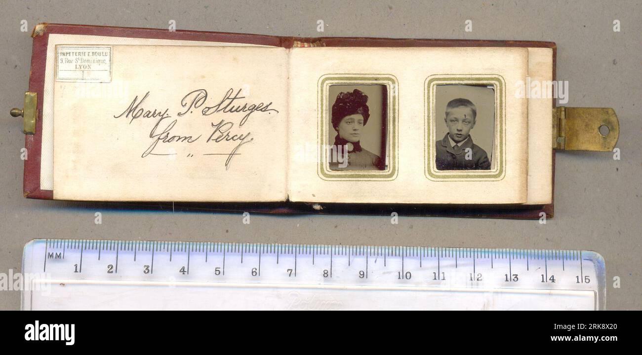 Miniature album for Portrait Stamps shown open with two examples circa ...
