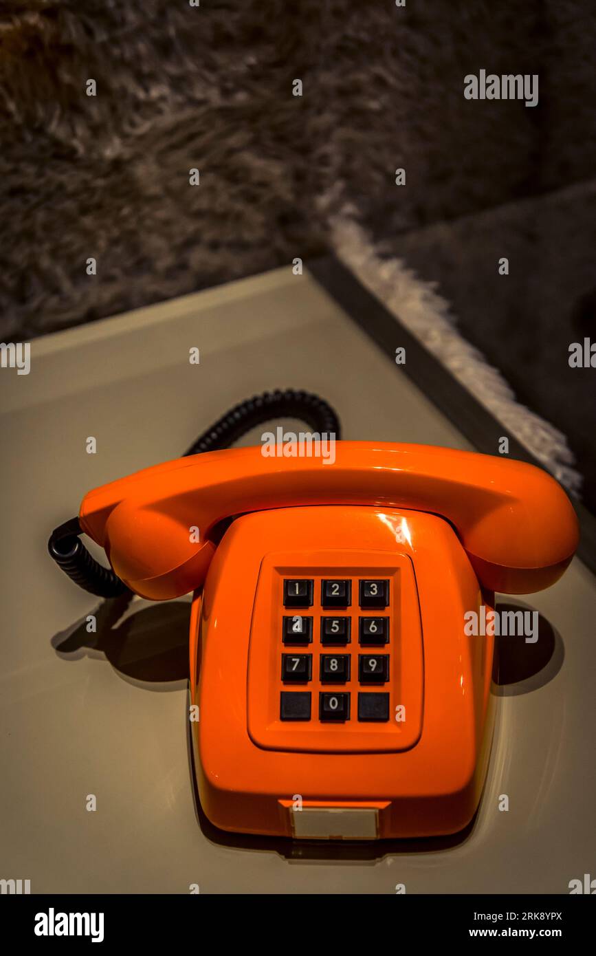 Orange 1960s telephone Stock Photo - Alamy