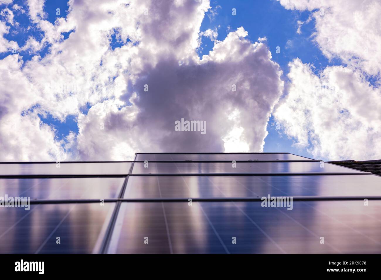 Dark clouds bring shadow on the solar panels of a photovoltaic plant ...