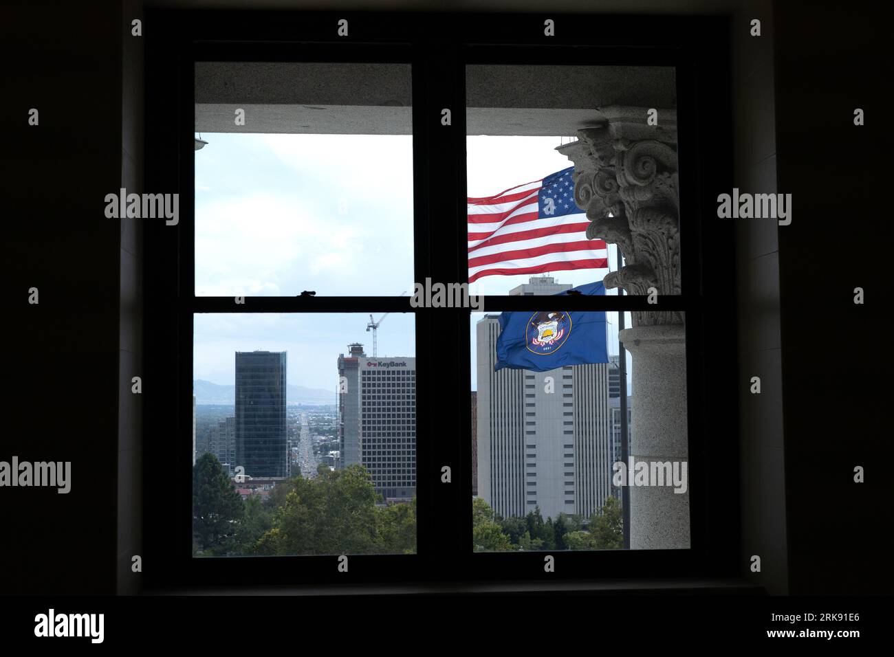 View of downtown Salt Lake City, US flag, and Utah flag, as seen ...