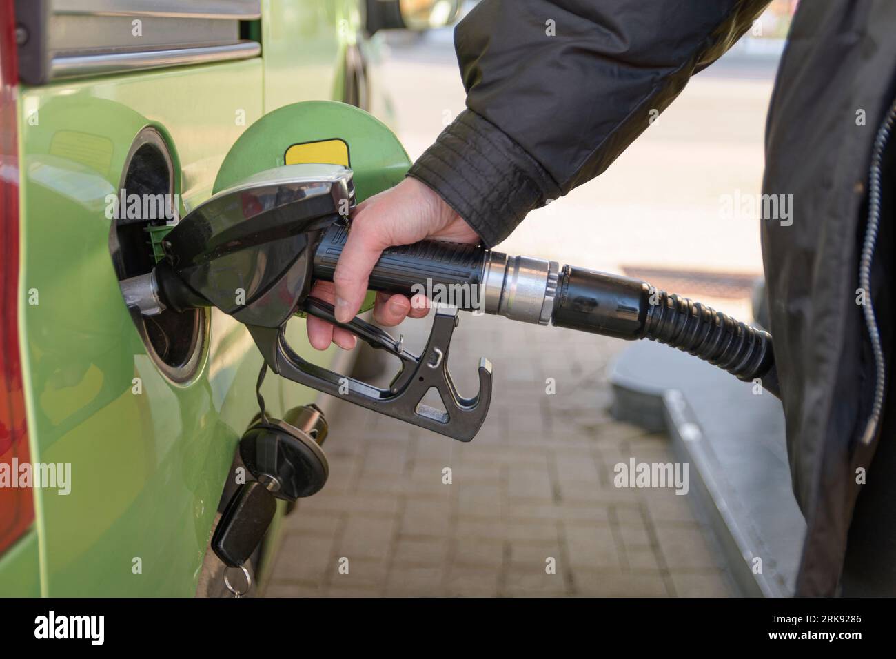 Woman filling diesel engine hi-res stock photography and images - Alamy
