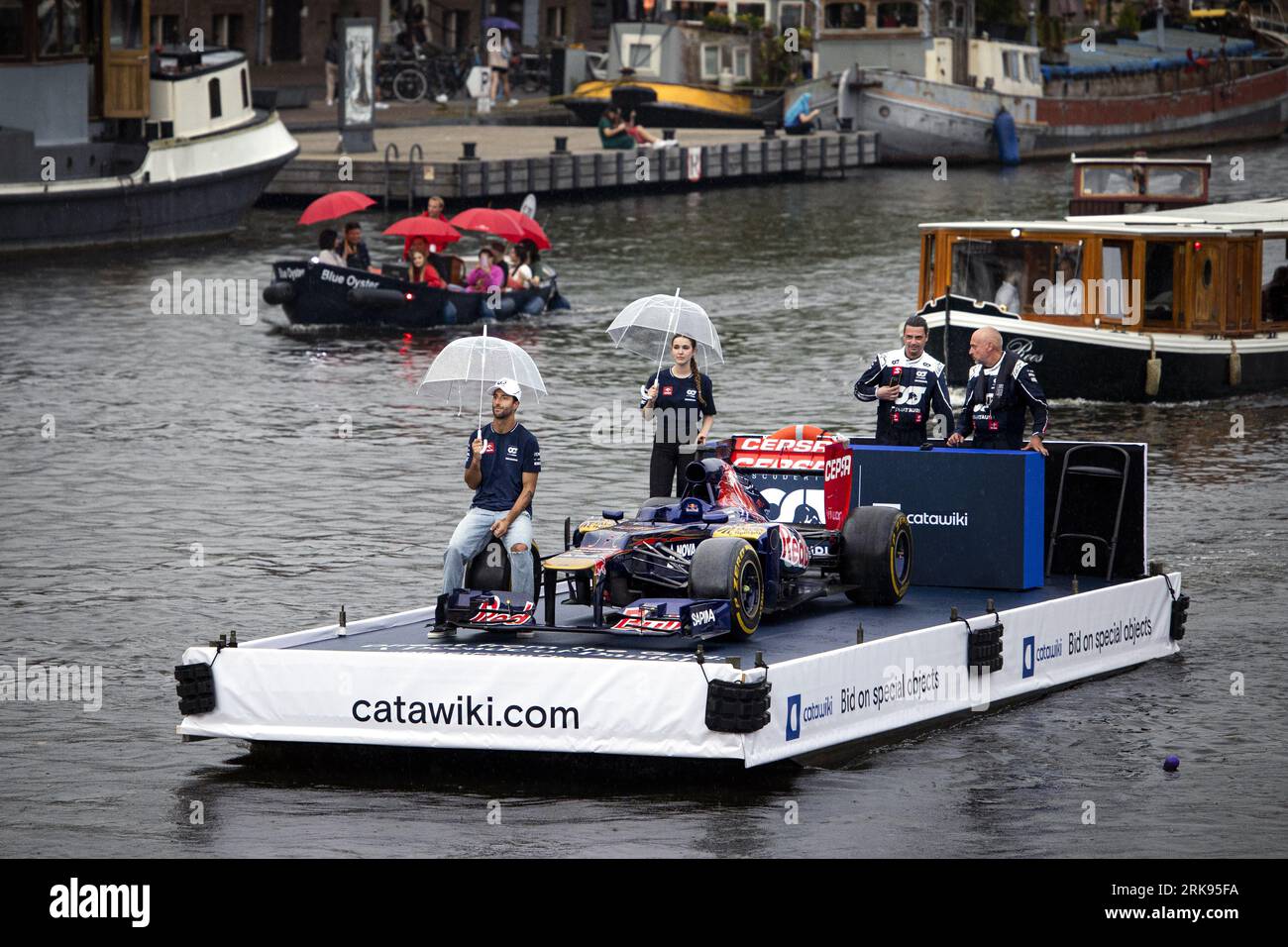 AMSTERDAM - Formula 1 driver Daniel Ricciardo sails on a boat through ...