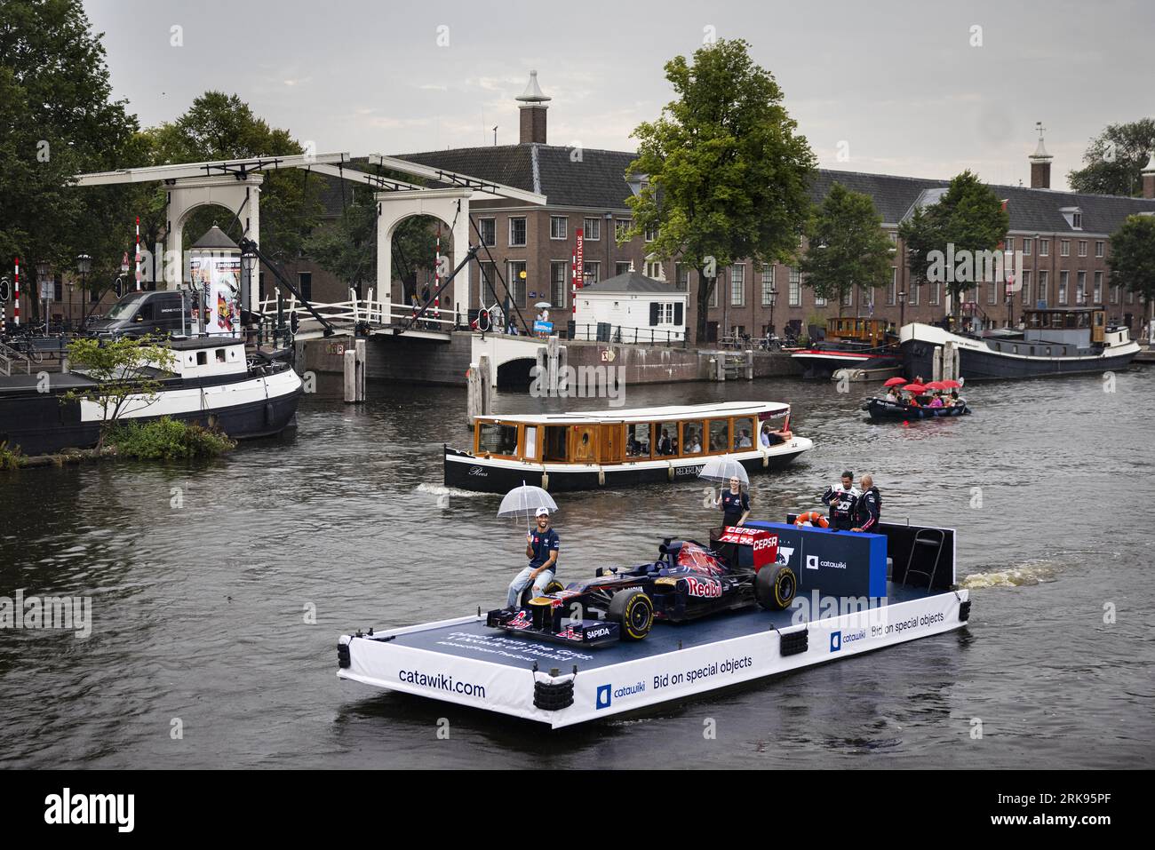 AMSTERDAM - Formula 1 driver Daniel Ricciardo sails on a boat through ...