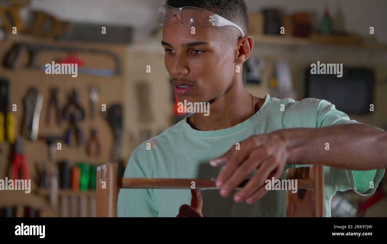 Young black apprentice furniture building hi-res stock photography and ...