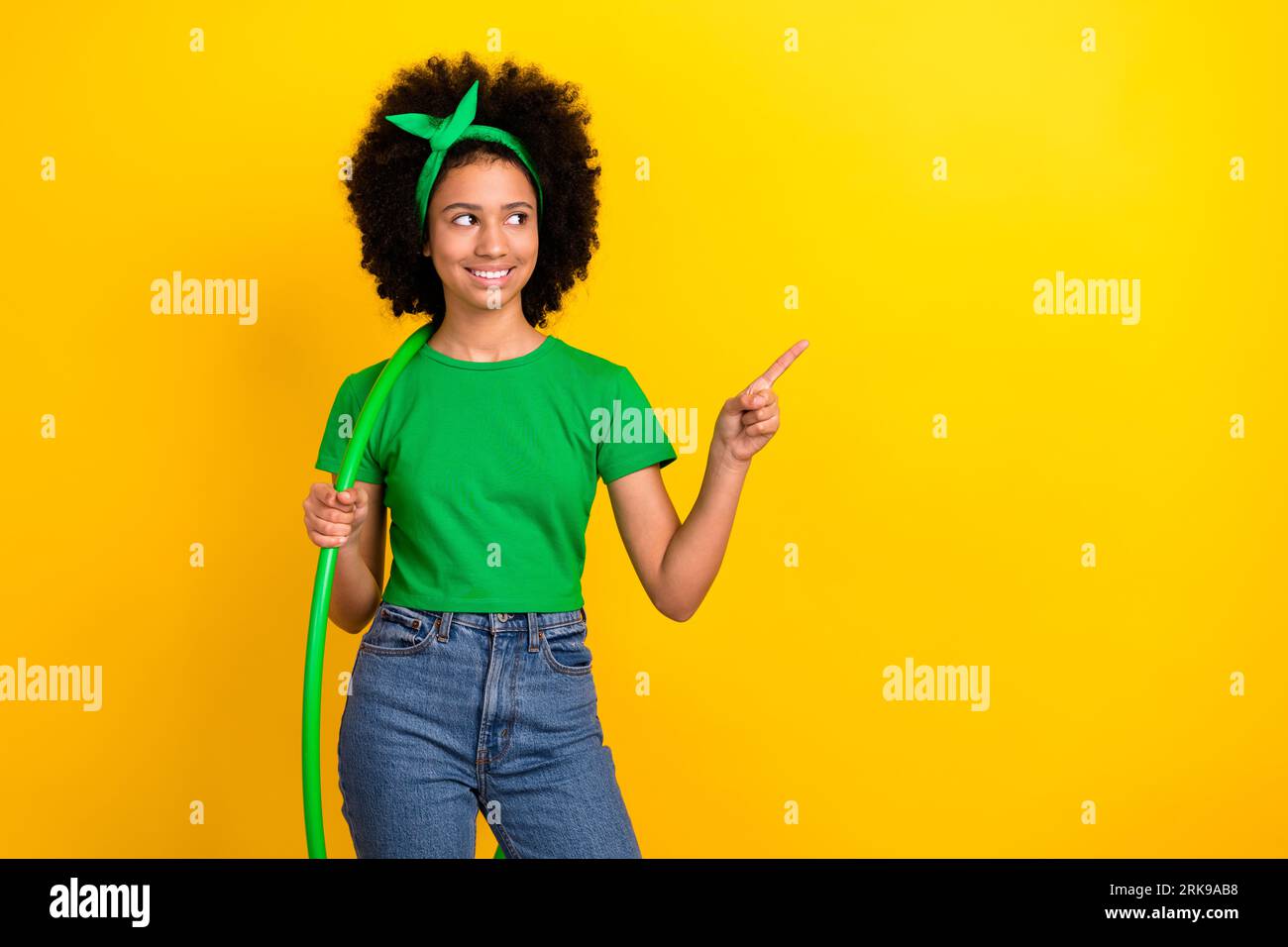 Photo of charming teen schoolgirl hold hula hoop look direct finger ...