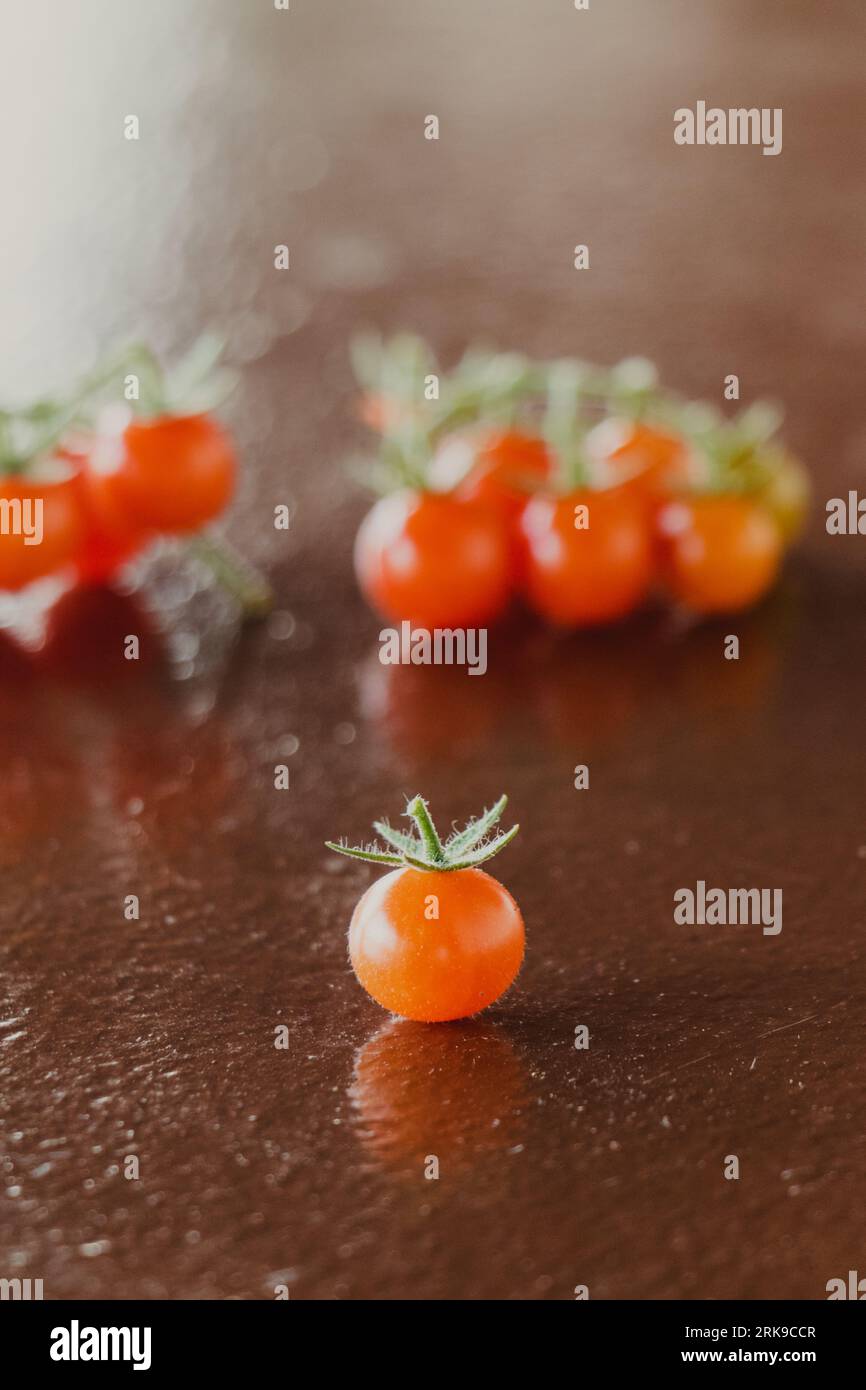 Little red tomato hi-res stock photography and images - Alamy