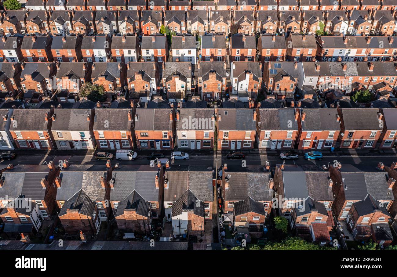 An aerial view above the drab rooftops of run down back to back ...
