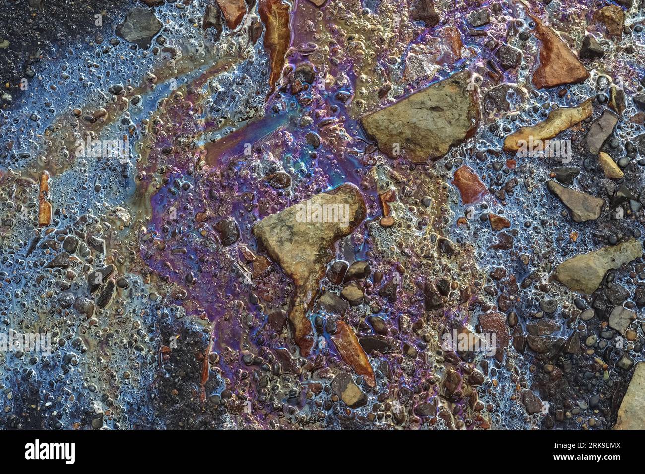 Colorful Fuel And Oil On An Asphalt Texture Showing Heavy Enviromental ...