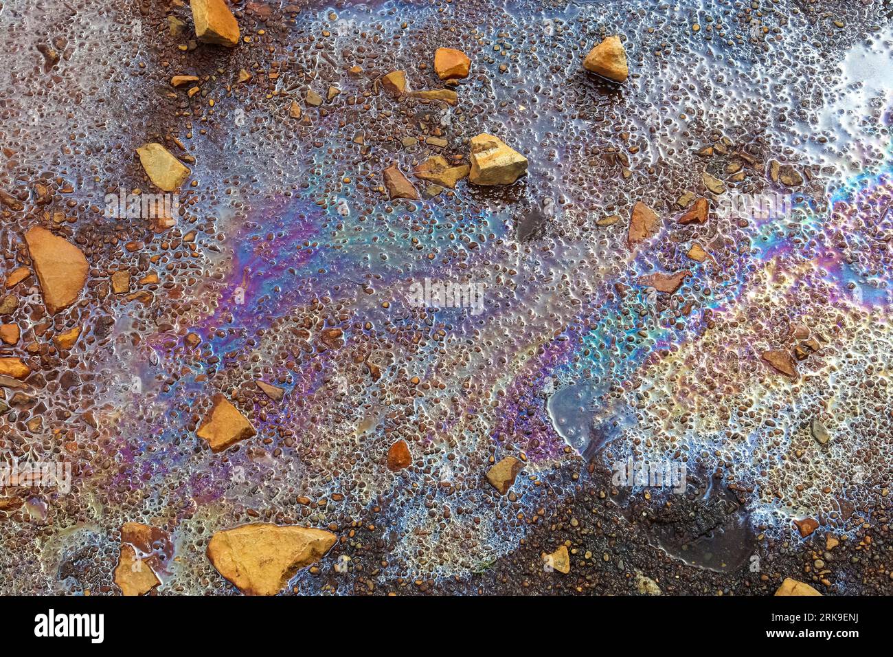 Colorful Fuel And Oil On An Asphalt Texture Showing Heavy Enviromental ...