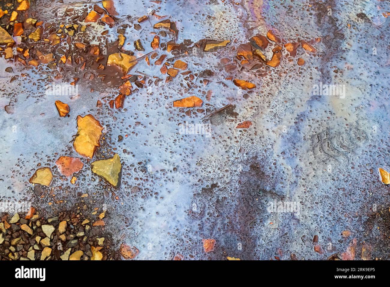 Colorful Fuel And Oil On An Asphalt Texture Showing Heavy Enviromental ...
