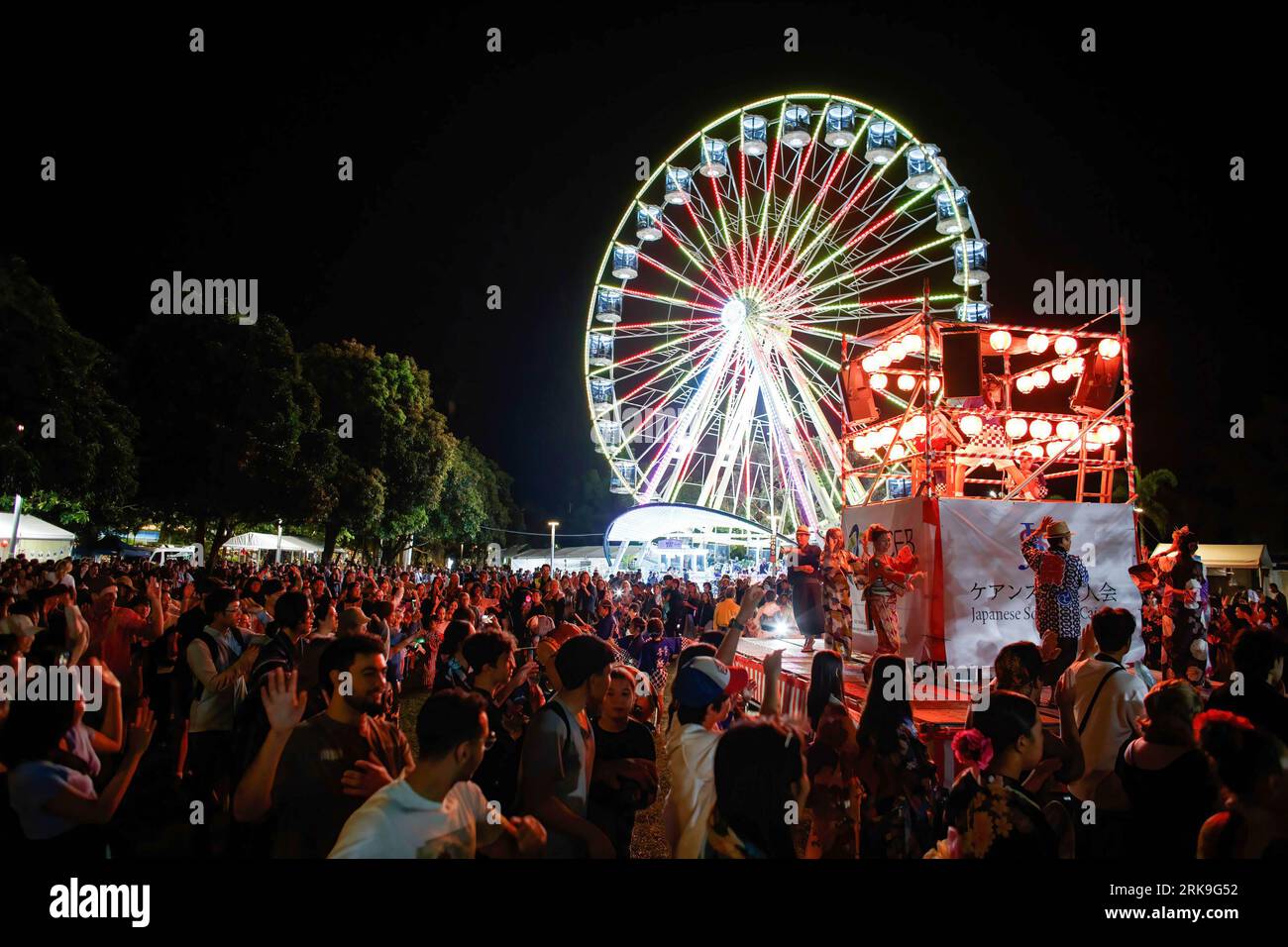 The crowd joins the dance beneath the Reef Eye during the Japan Bon ...