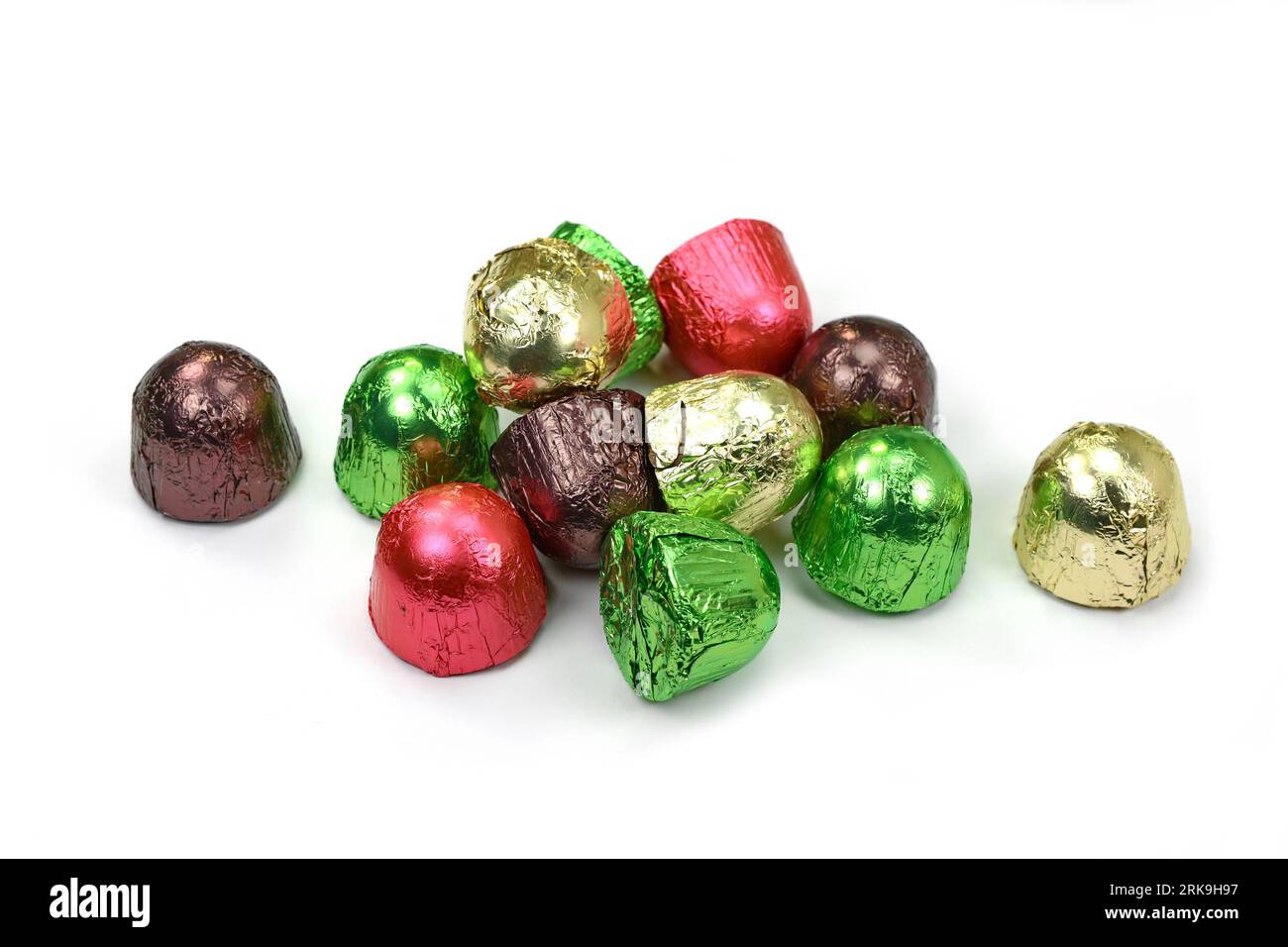 Chocolates in a multi-colored foil isolated on white background Stock ...