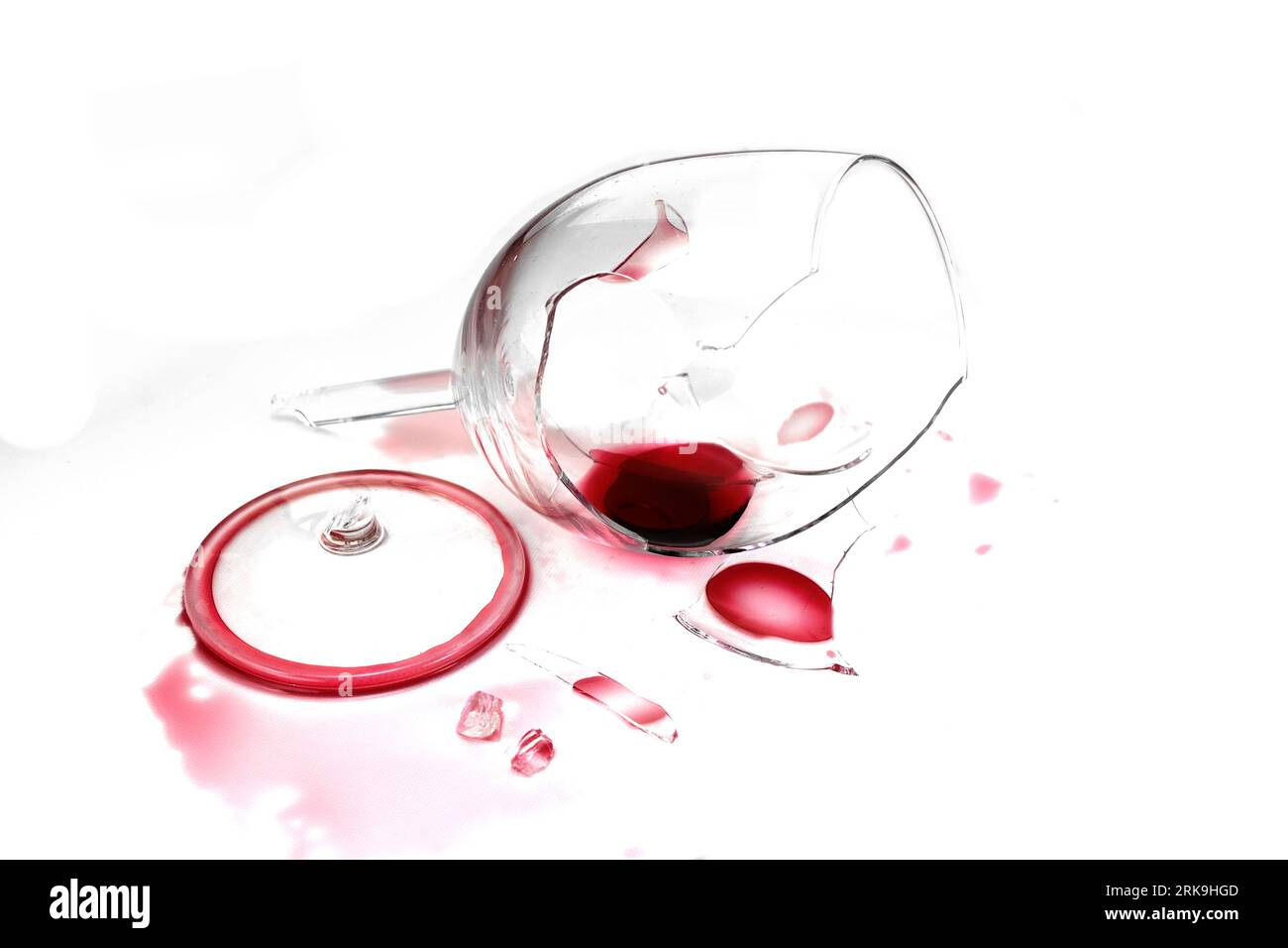 Broken glass and spilled red wine on white background Stock Photo - Alamy