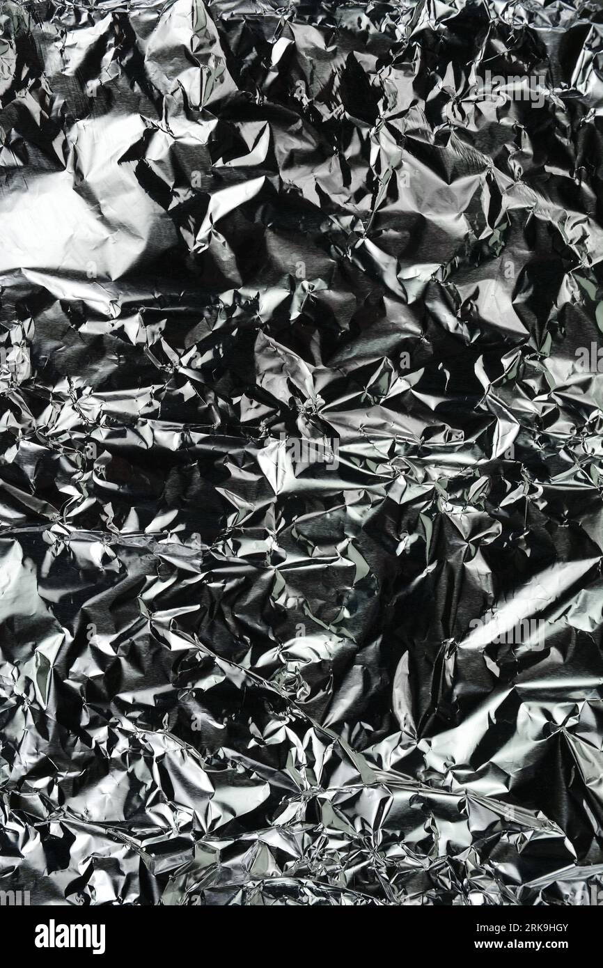 Aluminum foil background with shiny crumpled surface for texture ...