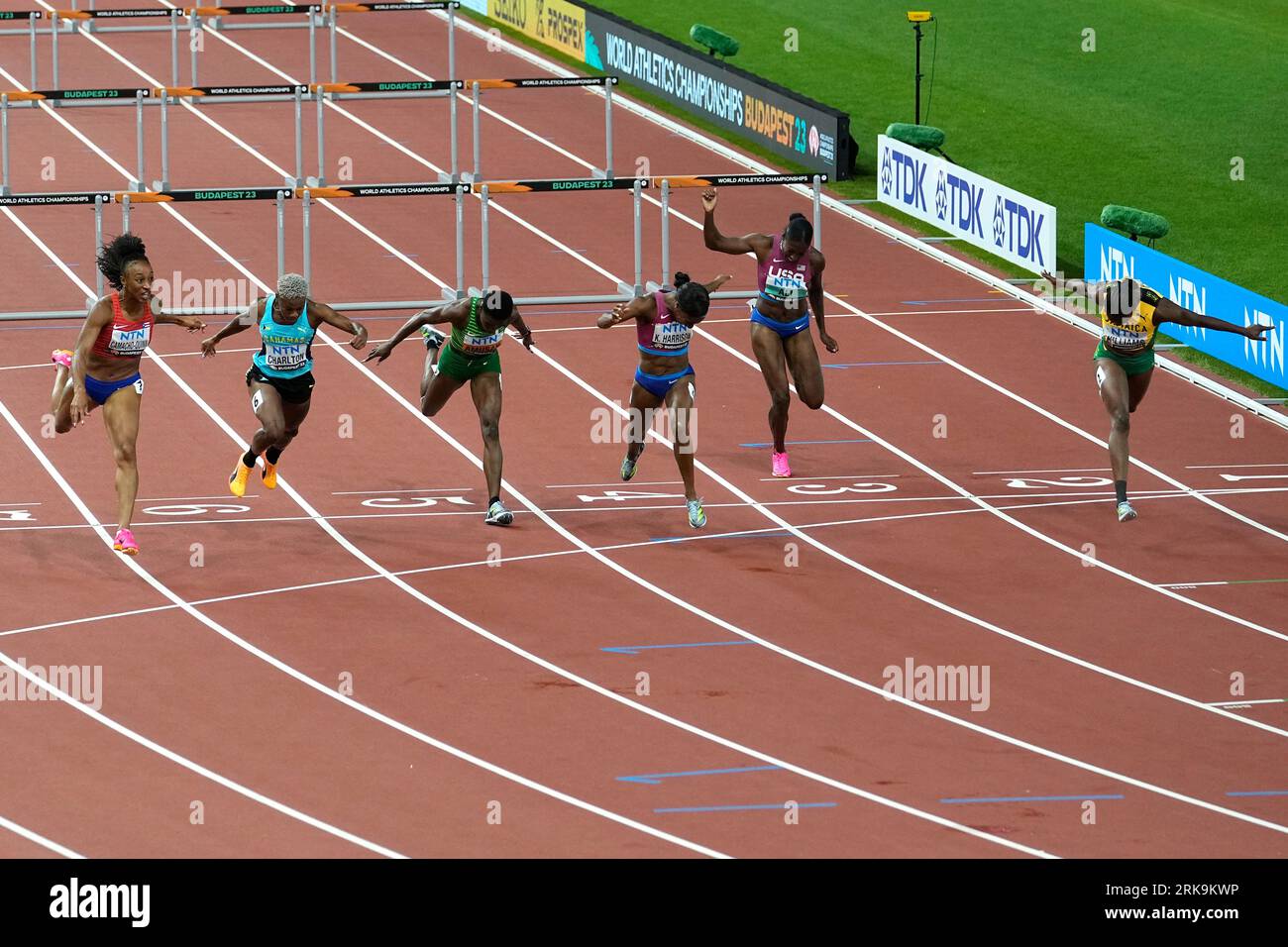 Danielle Williams, of Jamaica, right, crosses the line to win the gold ...