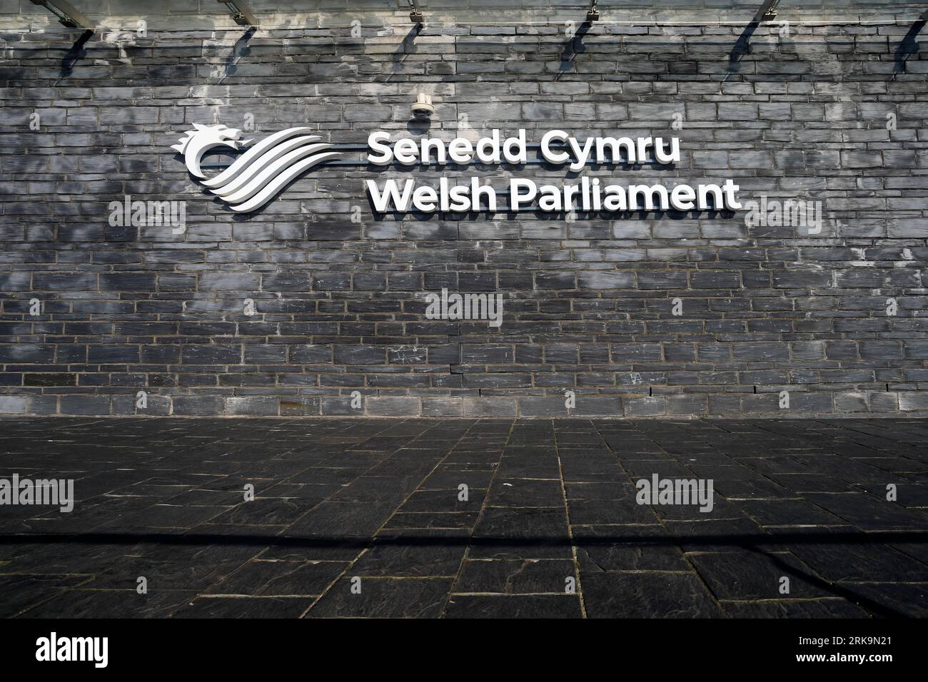 Welsh Parliament sign on the side of the Senedd Building, Cardiff Bay ...