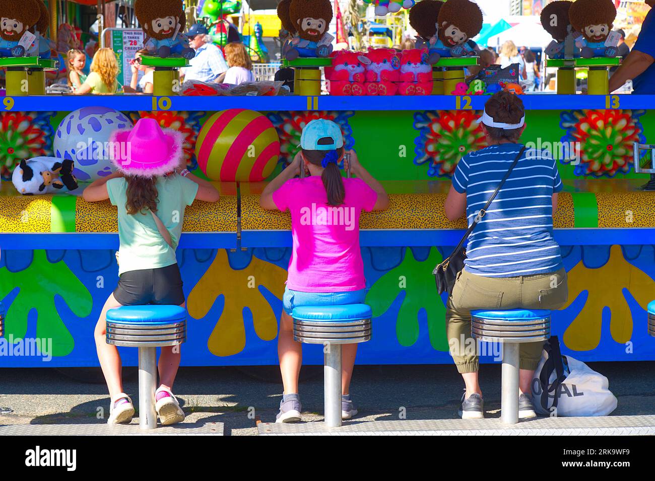 Playing a game at the Marshfield Fair. Marshfield, Massachusetts, USA ...