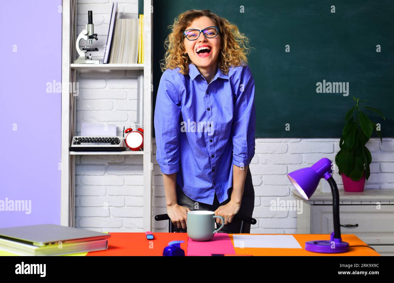 Teachers job. Happy female teacher in classroom. Smiling teacher woman ...