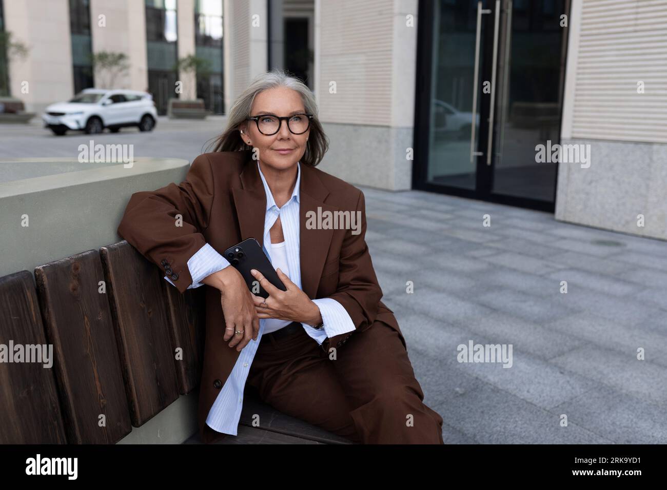 portrait of a confident successful 60 year old gray-haired business ...