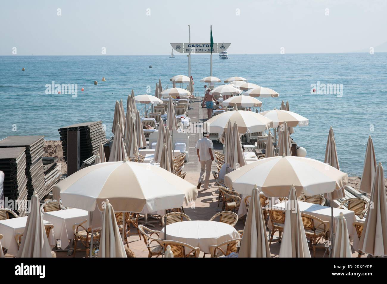 Cannes, French Riviera, France - May 4 2011; Umbrellas and stacked ...