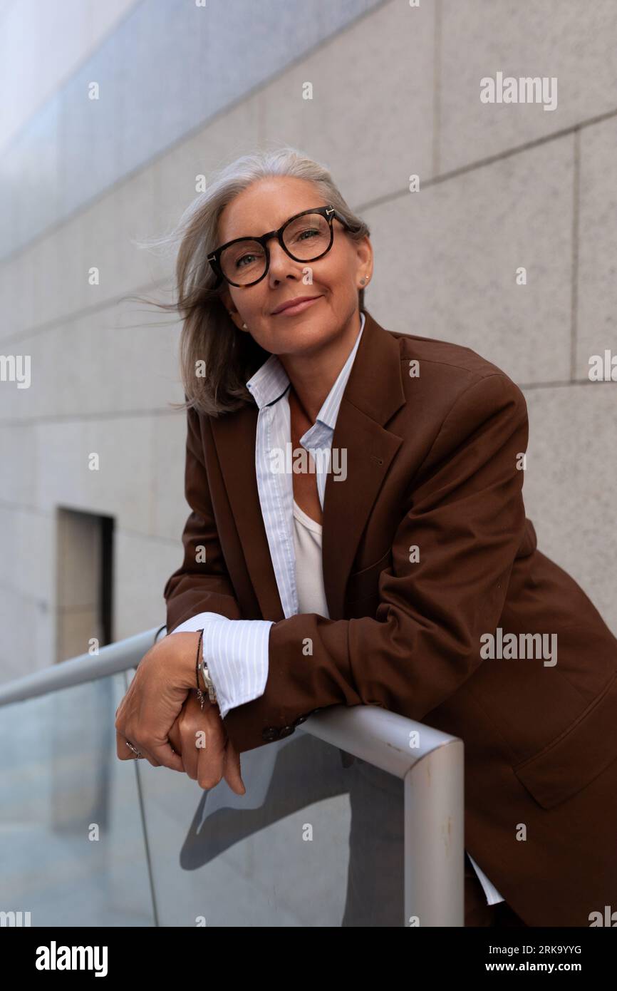 business portrait of a confident successful 60 year old gray-haired ...