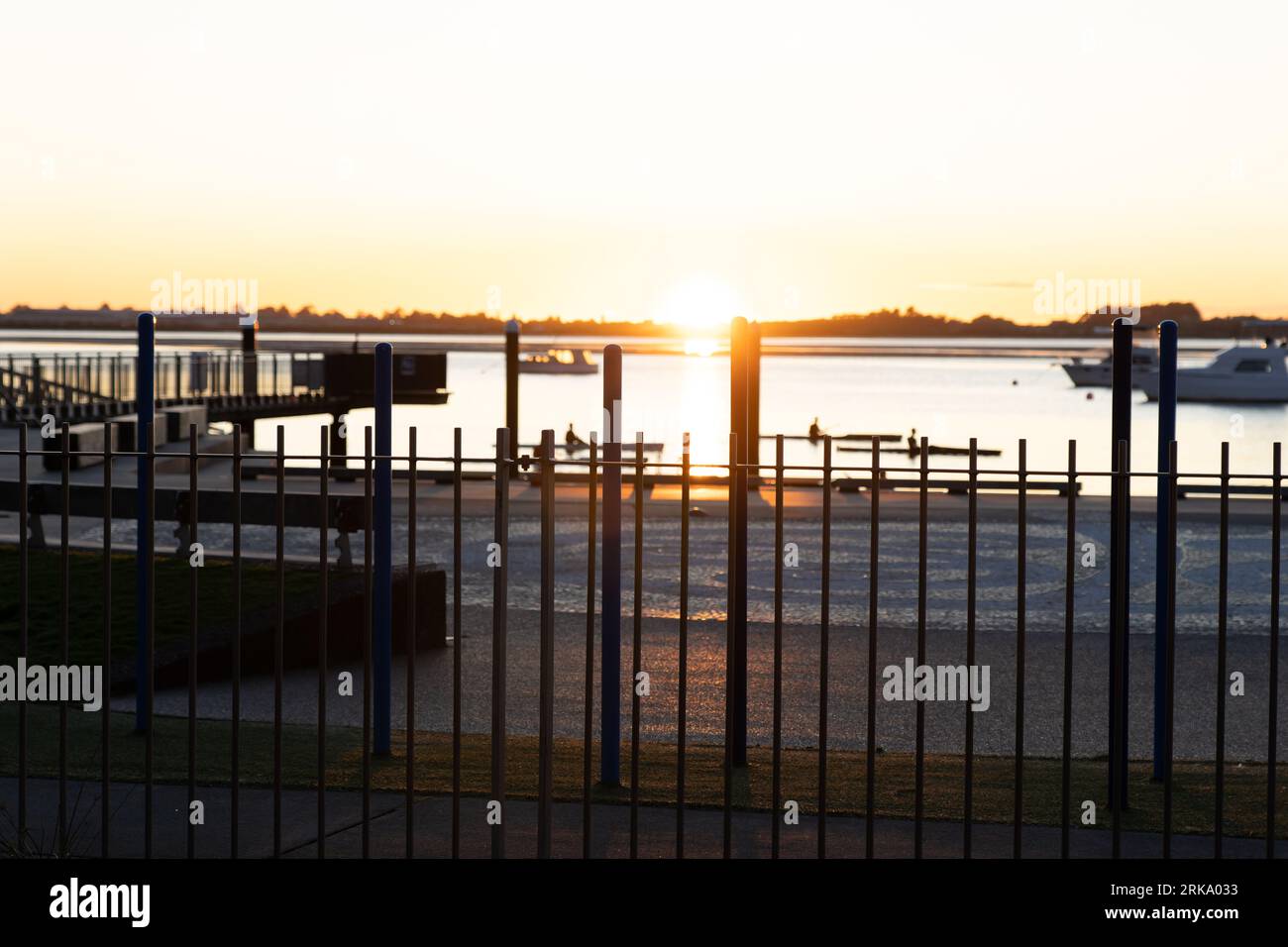 Tauranga background sunrise over The Strand waterfront with golden glow ...