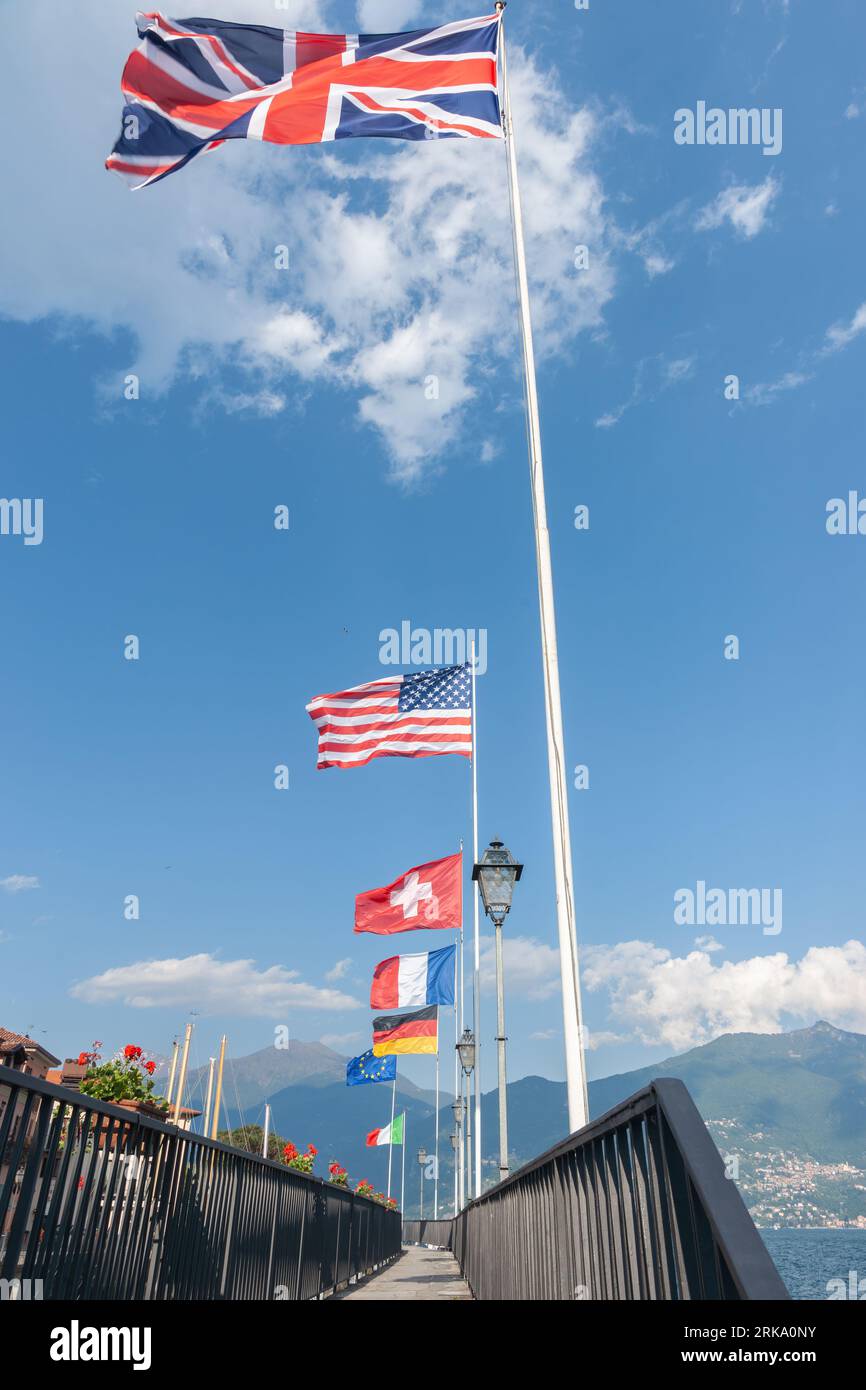 Row of flag poles with flags of European and other countries flying in ...