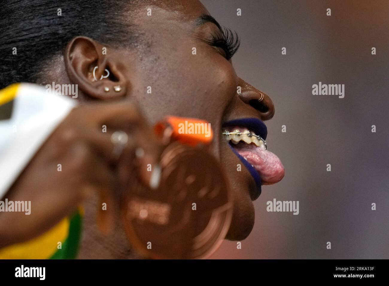 Rushell Clayton, of Jamaica, poses with her medal after taking bronze ...