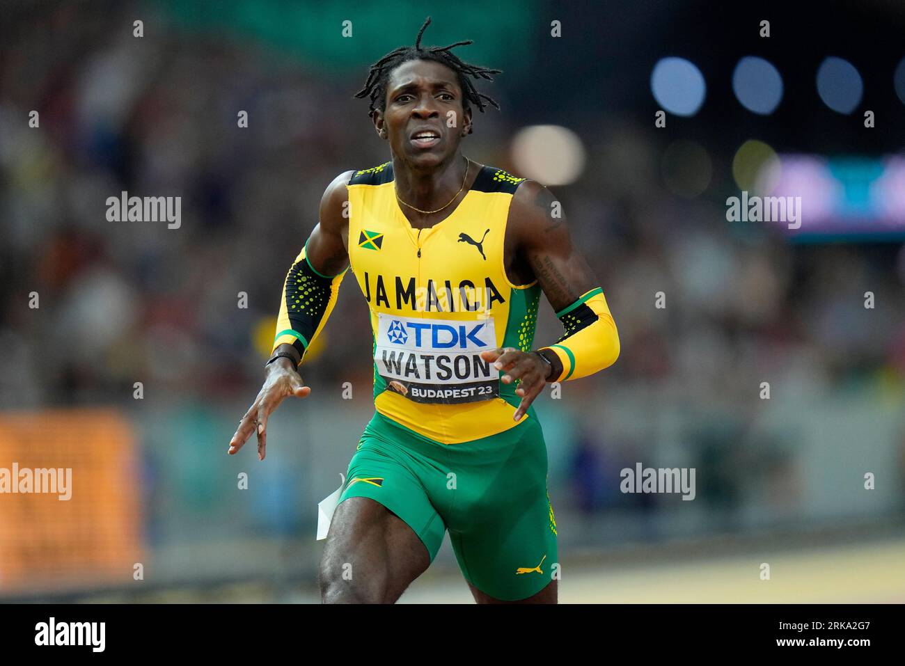 Antonio Watson, of Jamaica crosses the line to win the gold in the ...