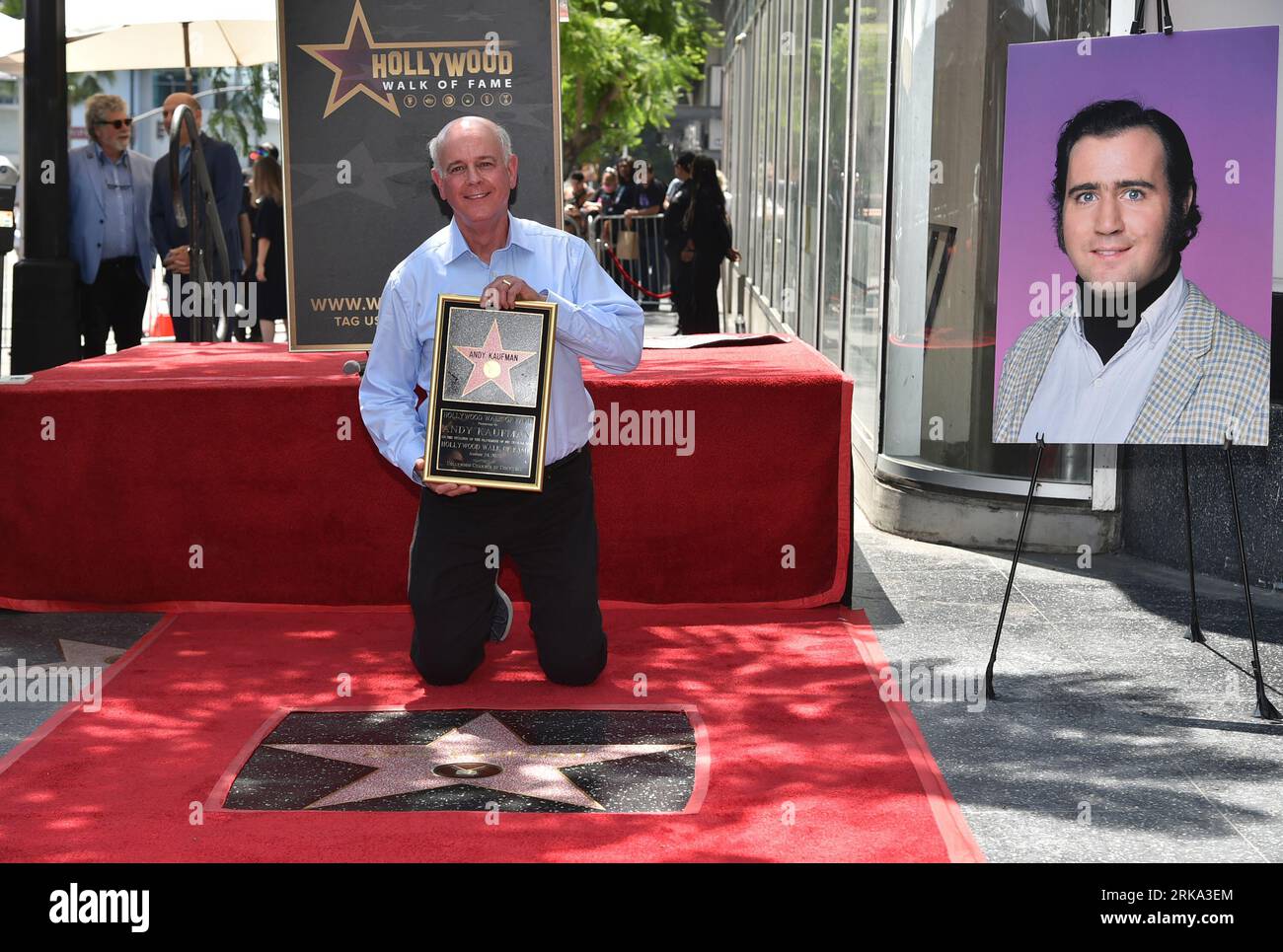 Michael Kaufman poses atop a star on the Hollywood Walk of Fame ...