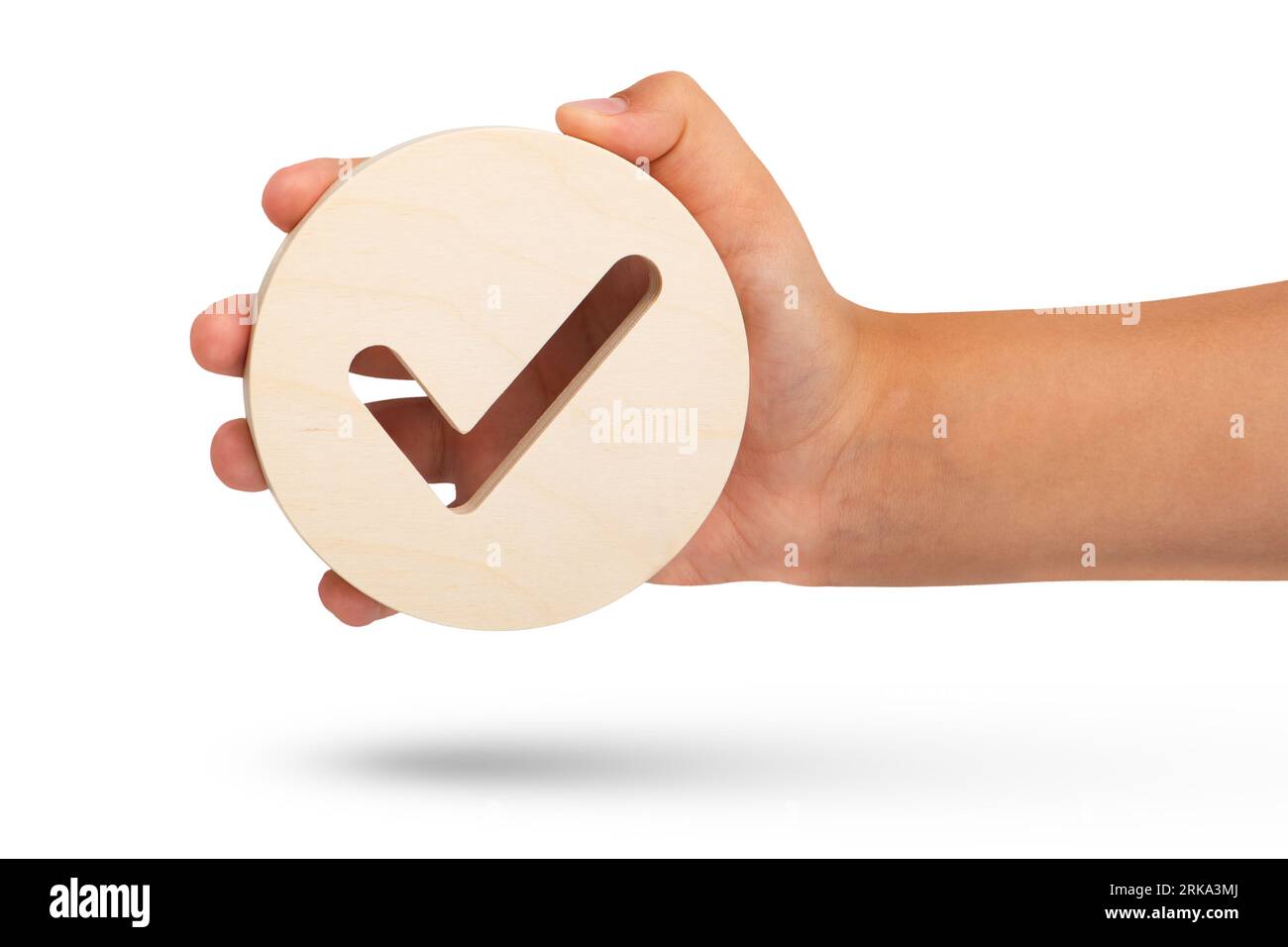 Isolate of hand holding check mark icon on white background. Closeup ...