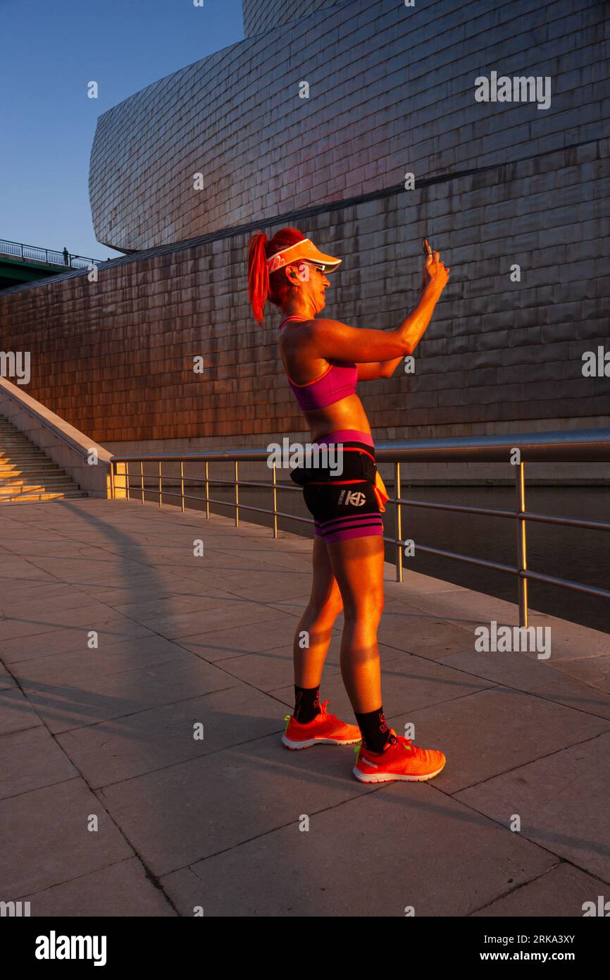 Bilbao, Spain - August 02, 2022: Fit tanned woman in sportswear with ...