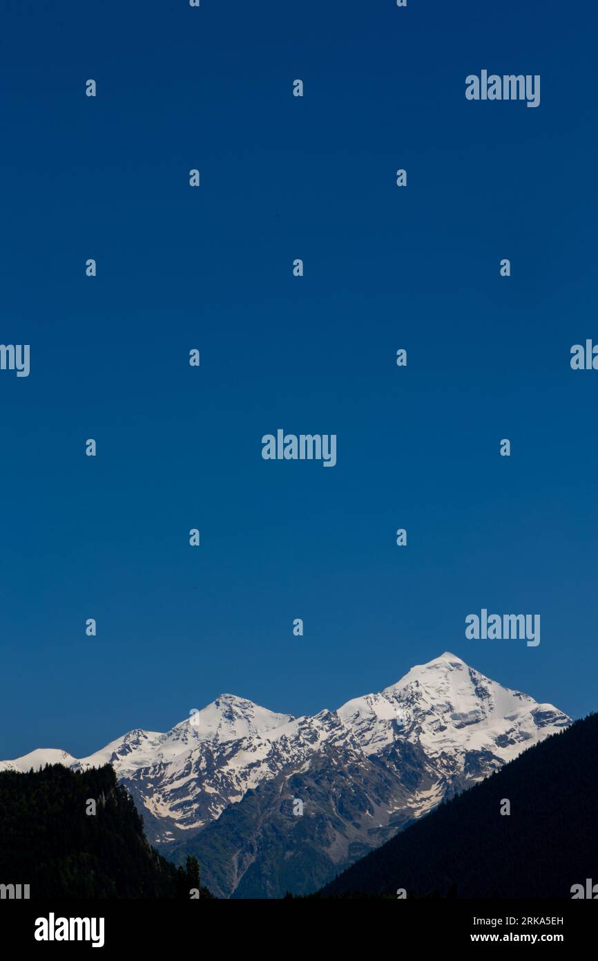 A vertical of snow-capped mountains in Mestia, Georgia Stock Photo - Alamy