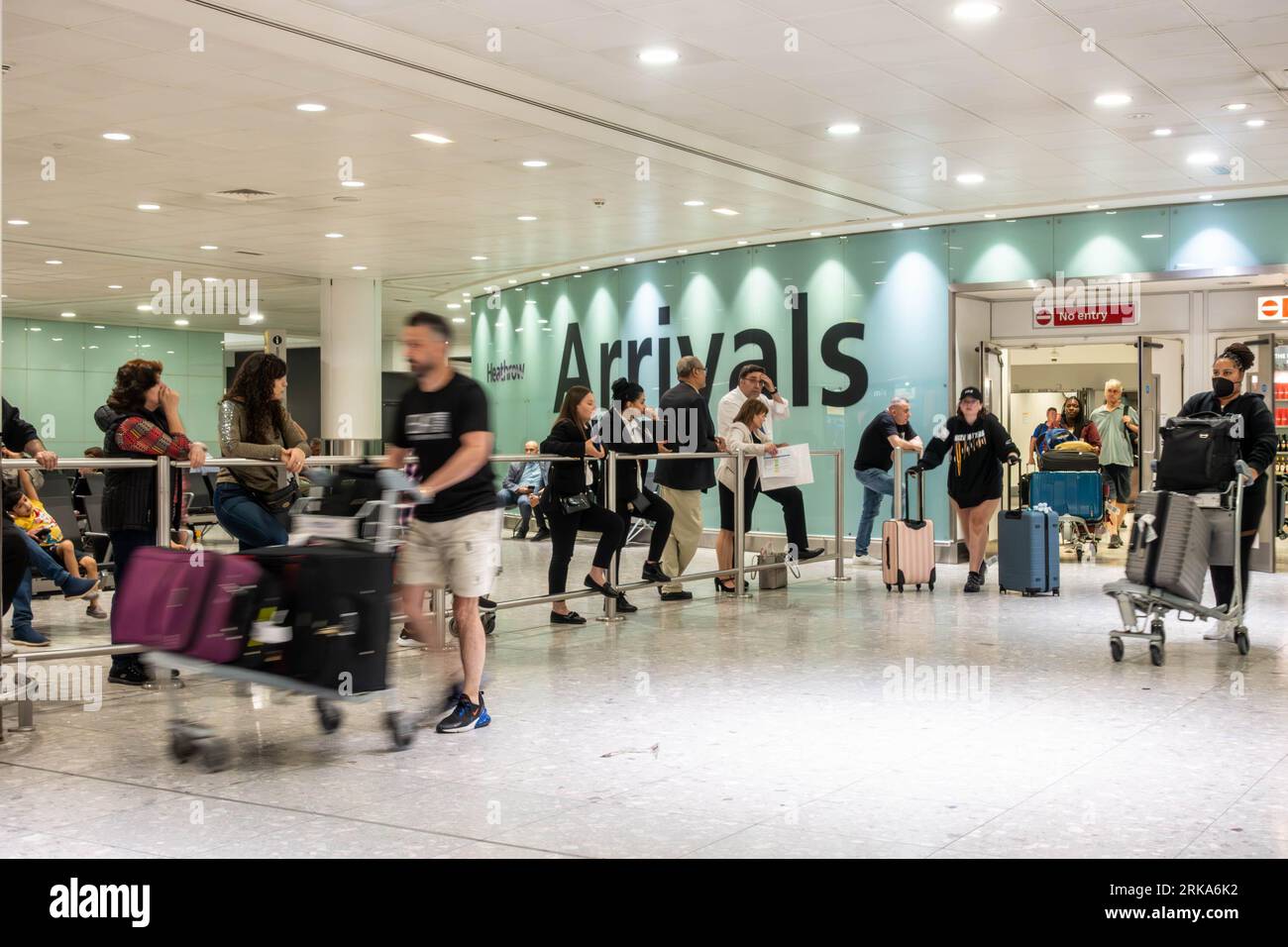 Passengers arriving at London Heathrow Airport Terminal 3, passing out ...