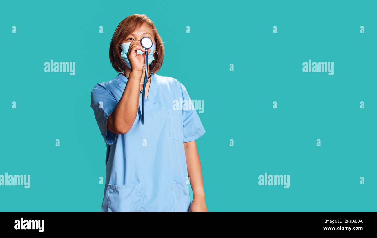 Asian experienced nurse doing mock up showing of properly using ...